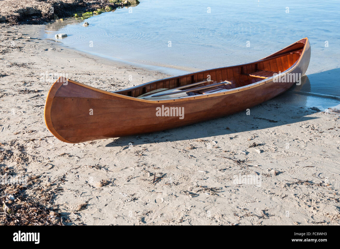 Canoe on a beach in Majorca Stock Photo - Alamy