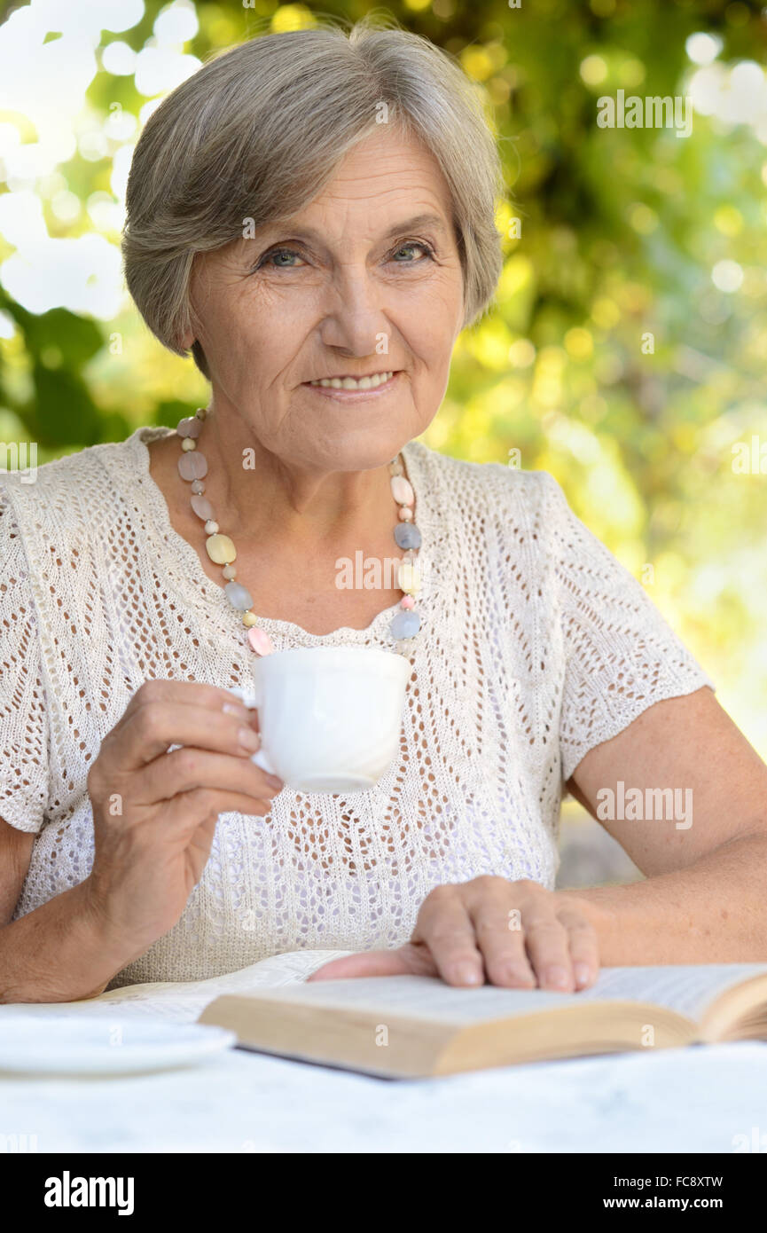 Middle-aged woman drink tea Stock Photo - Alamy