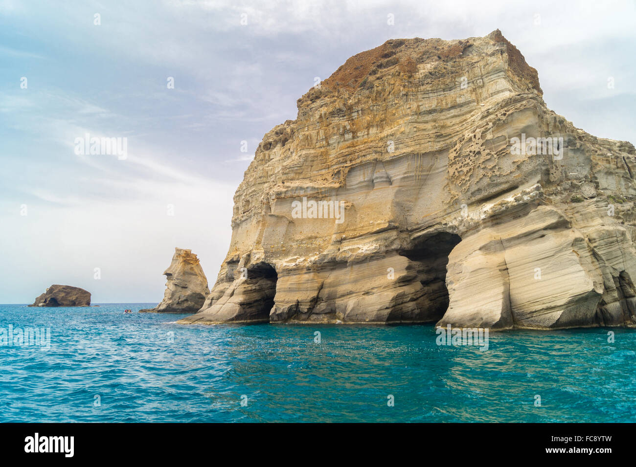 Caves and rock formations by the sea at Sarakiniko area in Milos island ...