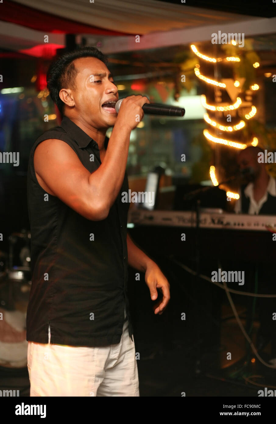 Singer white shirt hi-res stock photography and images - Alamy