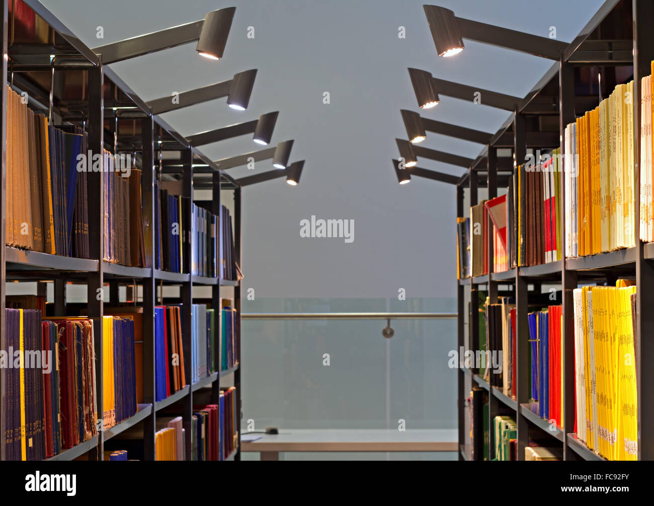 Shelves full of books in a modern library Stock Photo - Alamy