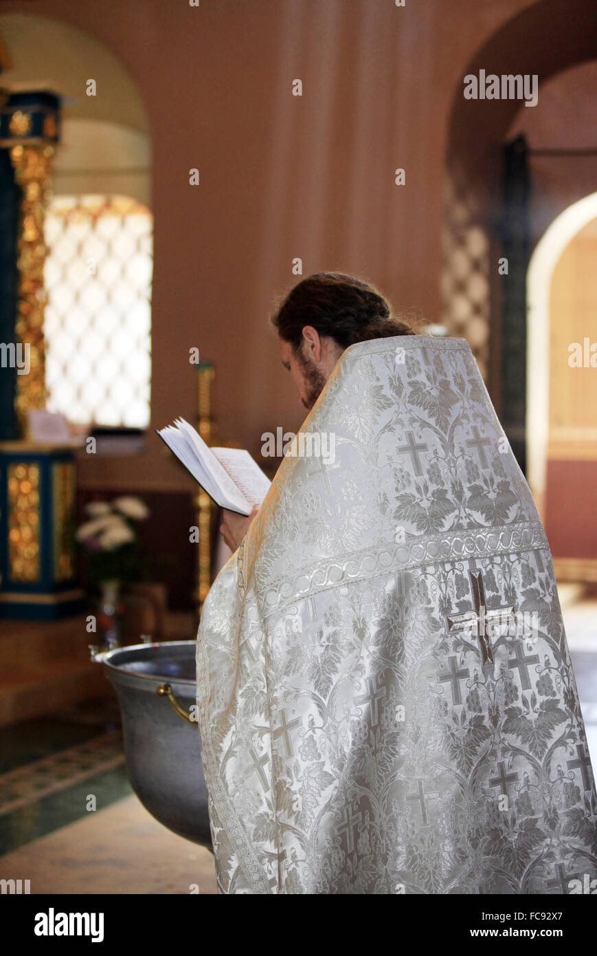 Priest with Bible Stock Photo - Alamy