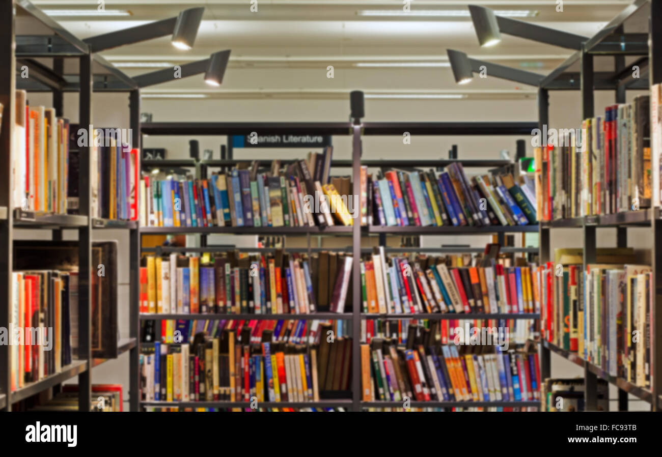 Blurred books in a modern public library Stock Photo - Alamy