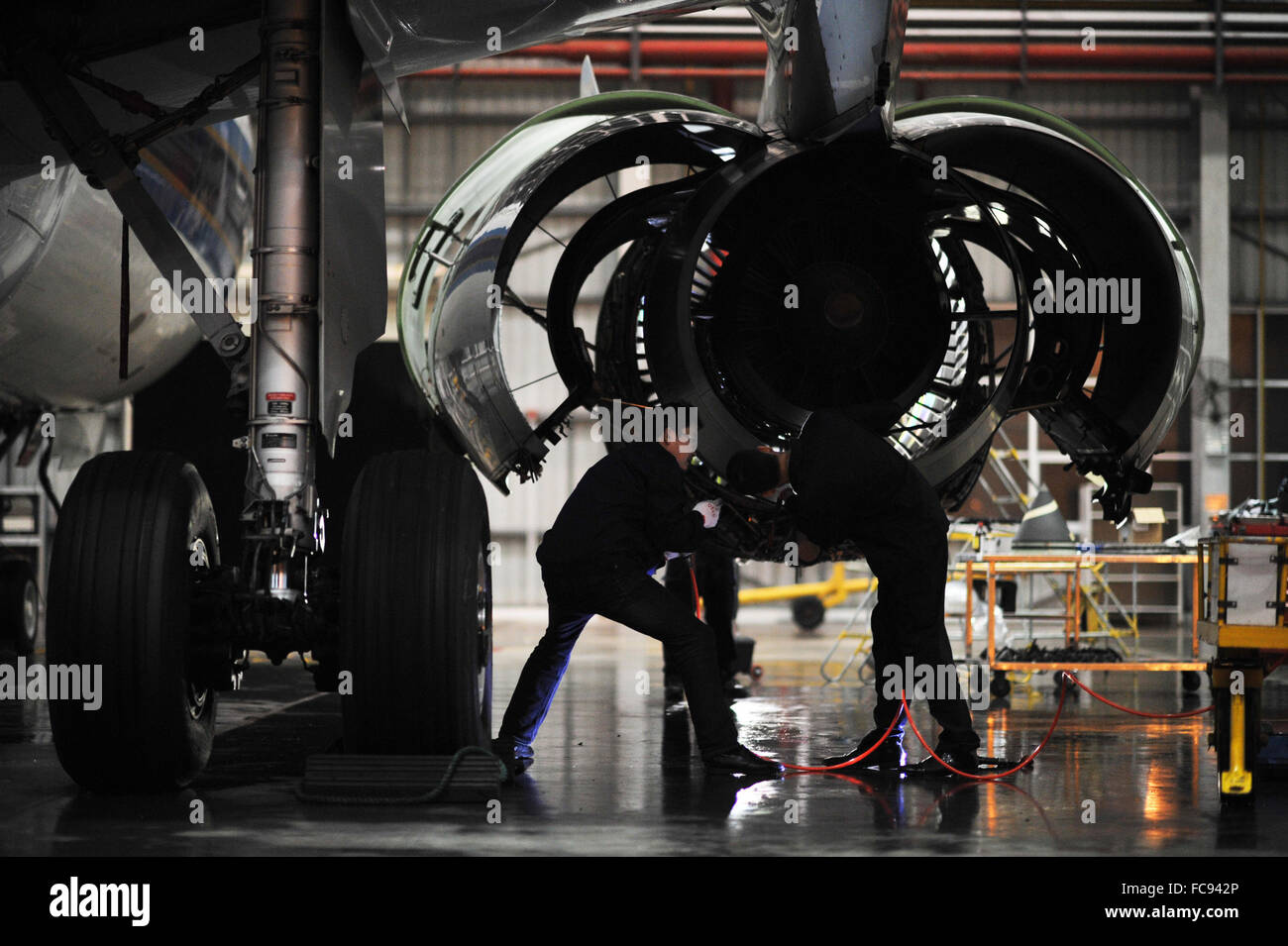 Haikou, China's Hainan Province. 21st Jan, 2016. Mechanics check an ...