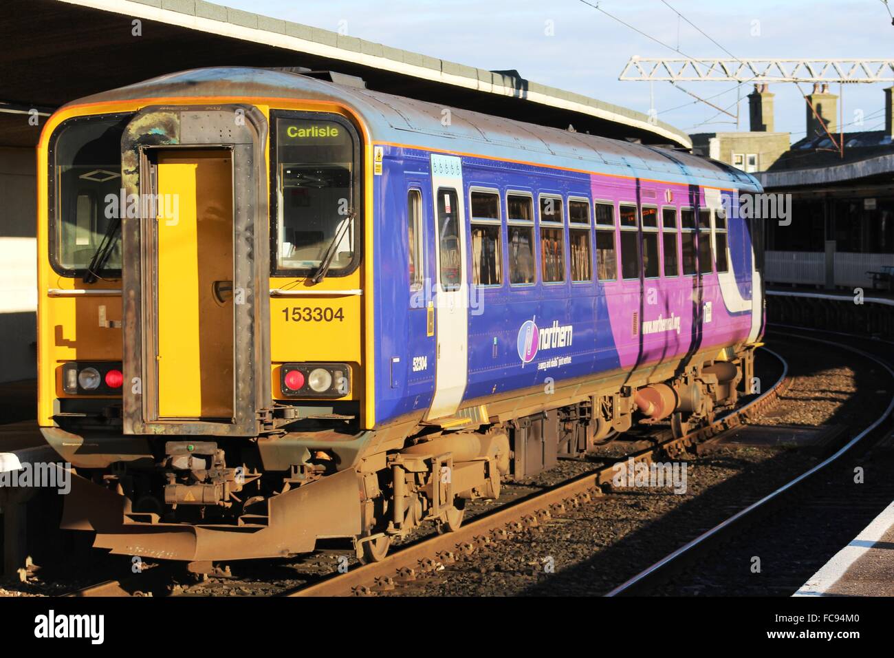 Class 153 diesel unit in Northern livery arriving at Carnforth railway ...