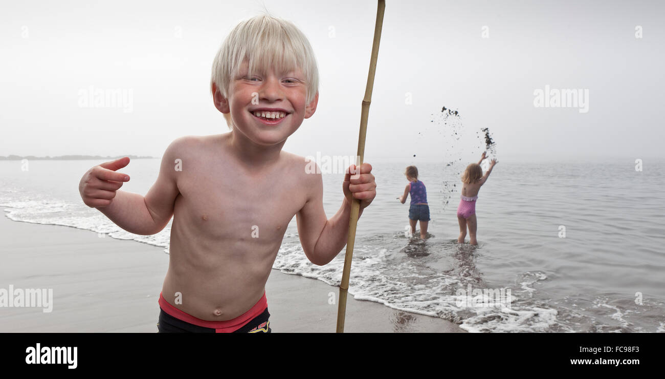 Boy with net playing at the beach, Akranes, Iceland Stock Photo - Alamy