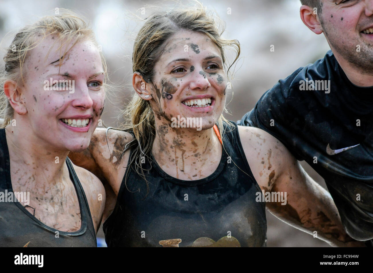 Muddy runners at obstacle course race, UK Stock Photo - Alamy