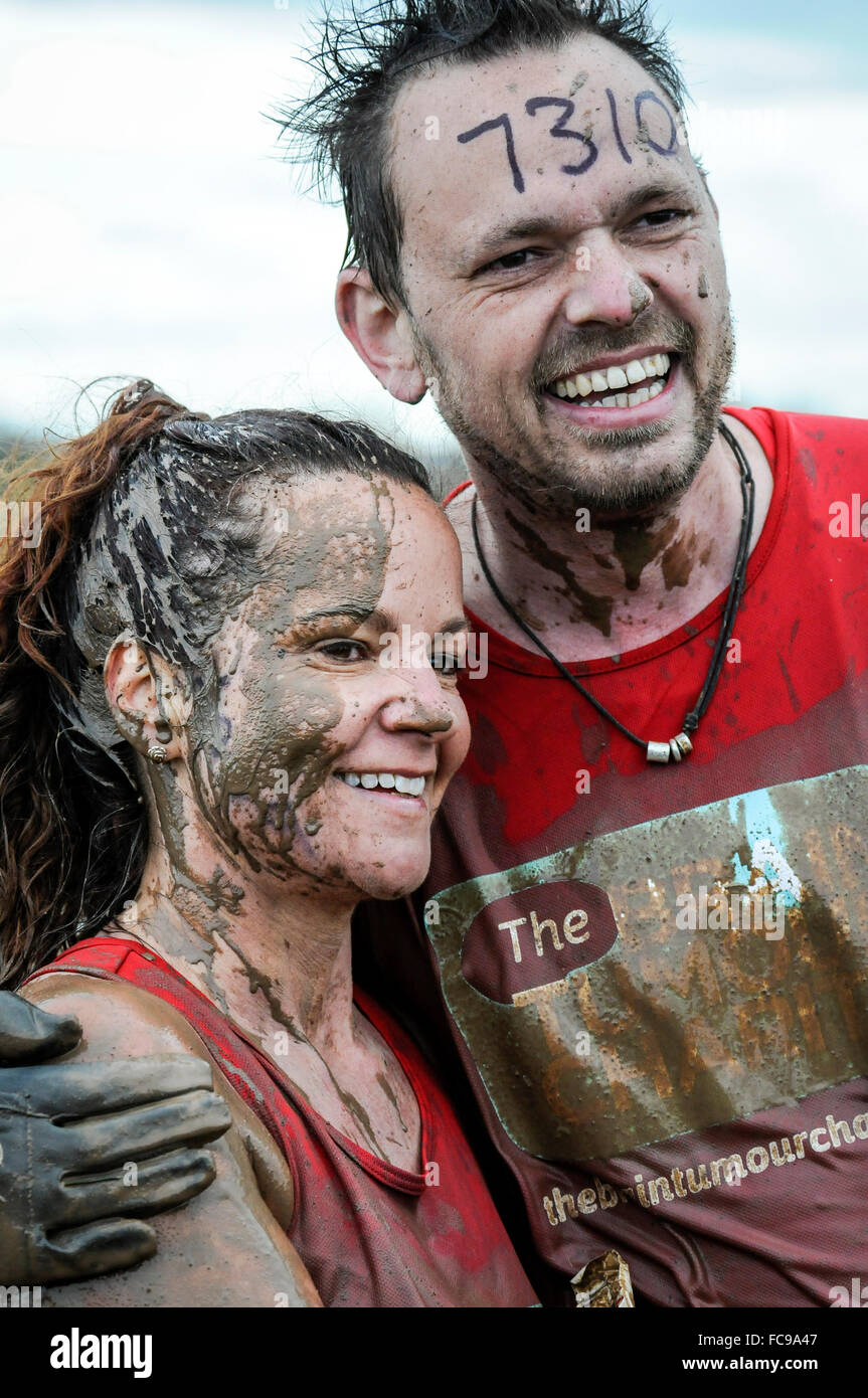 Muddy runners at obstacle course race, UK Stock Photo - Alamy