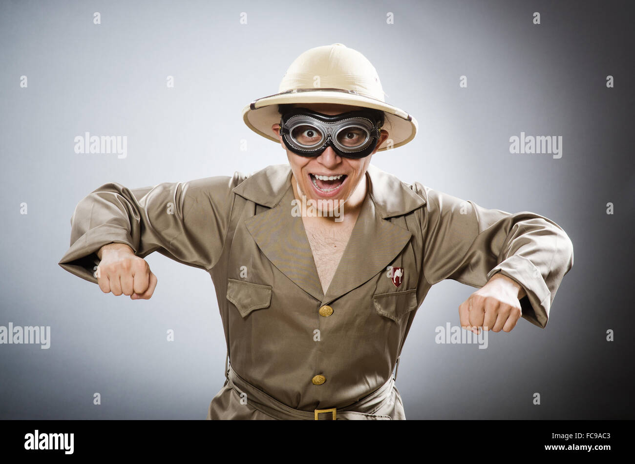 Funny safari traveller in travelling concept Stock Photo - Alamy