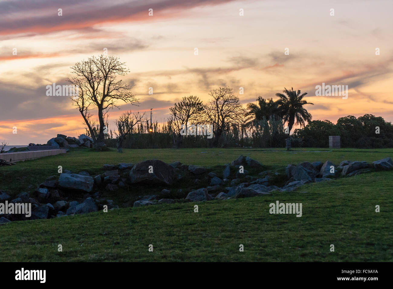 Beautiful nature sunset scene at the coast and boardwalk of Montevideo ...