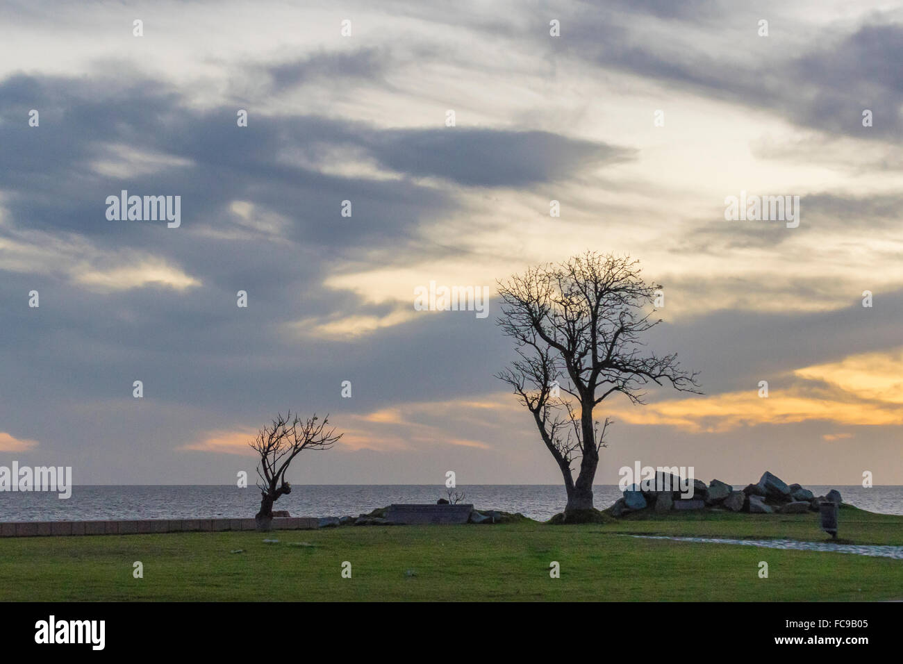 Beautiful nature sunset scene at the coast and boardwalk of Montevideo ...