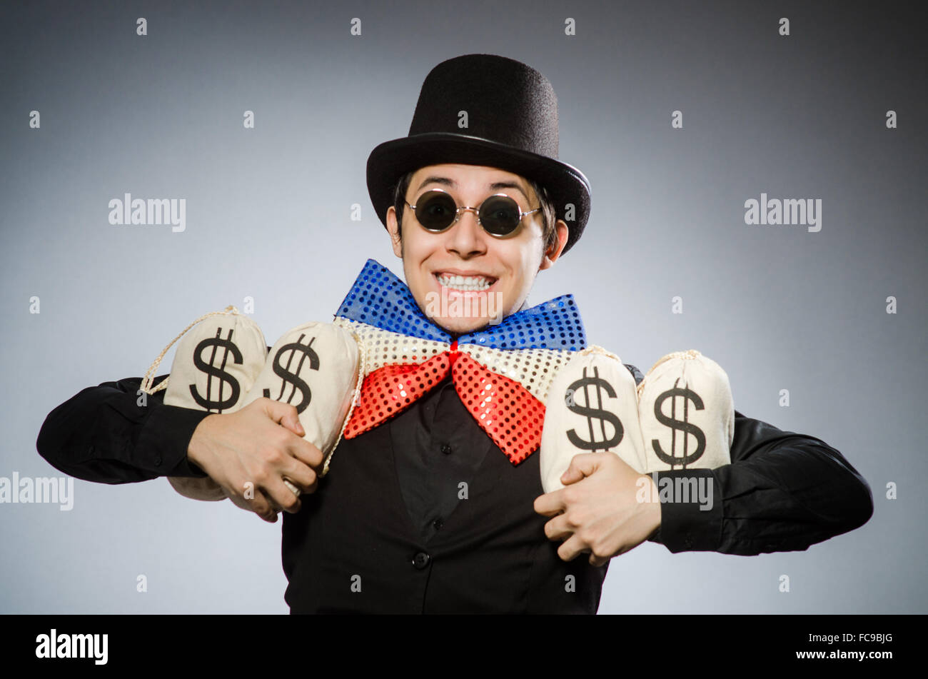 Funny man with money dollar sacks Stock Photo - Alamy