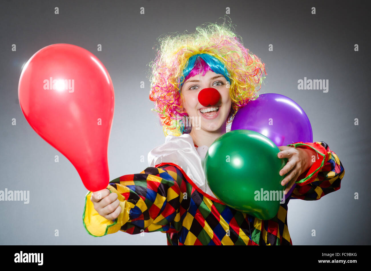 Funny clown in comical concept Stock Photo - Alamy