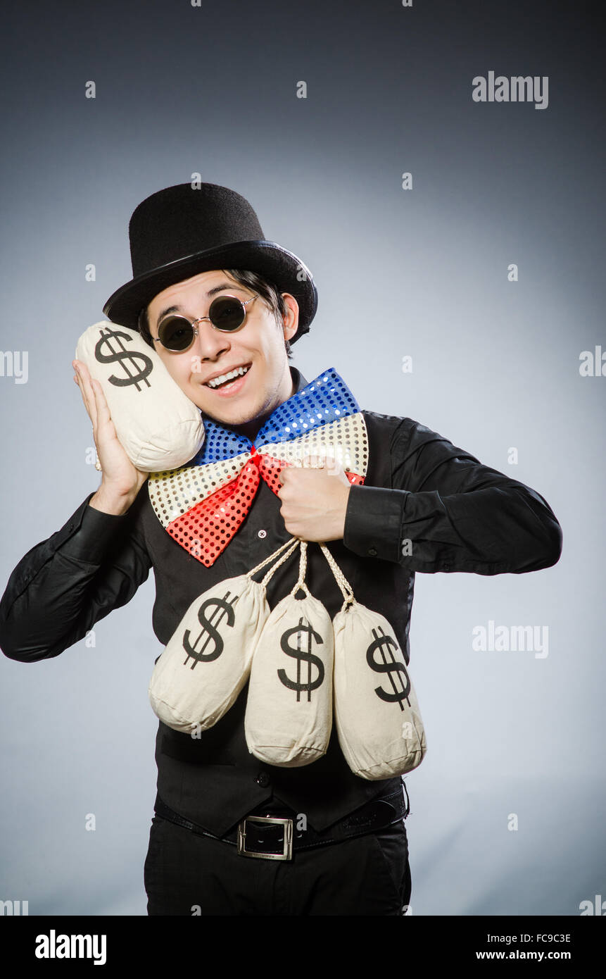 Funny man with money dollar sacks Stock Photo - Alamy