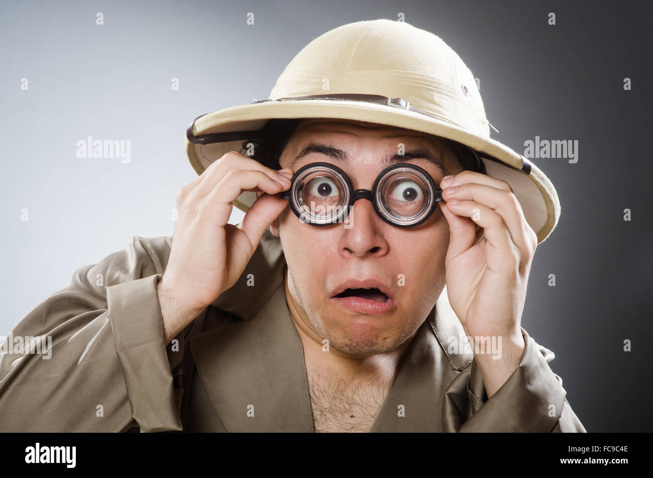 Funny safari traveller in travelling concept Stock Photo - Alamy