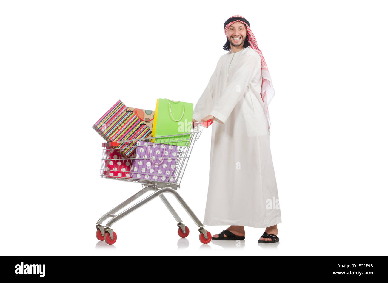 Arab man doing shopping isolated on white Stock Photo - Alamy