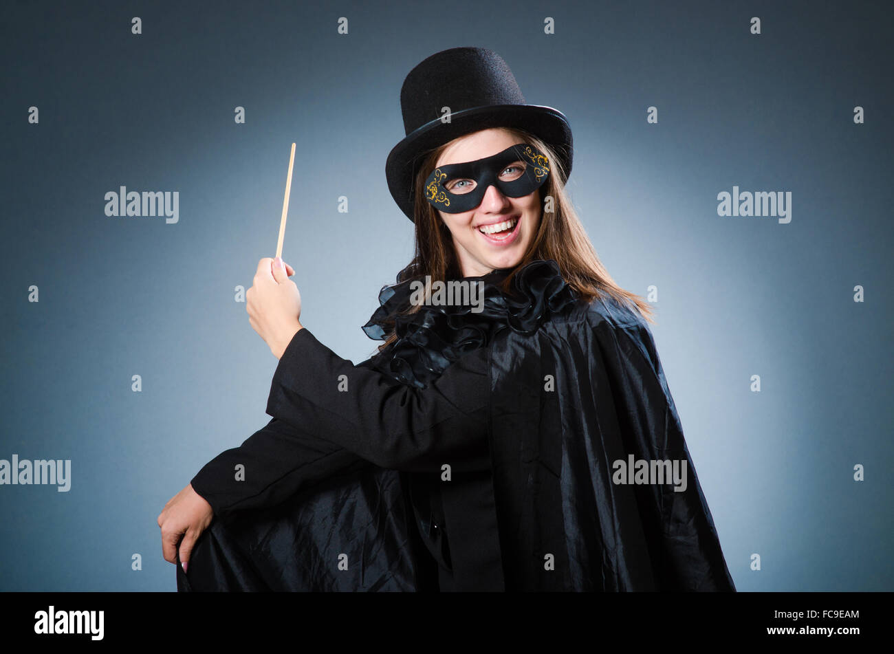 Woman magician in funny concept Stock Photo - Alamy
