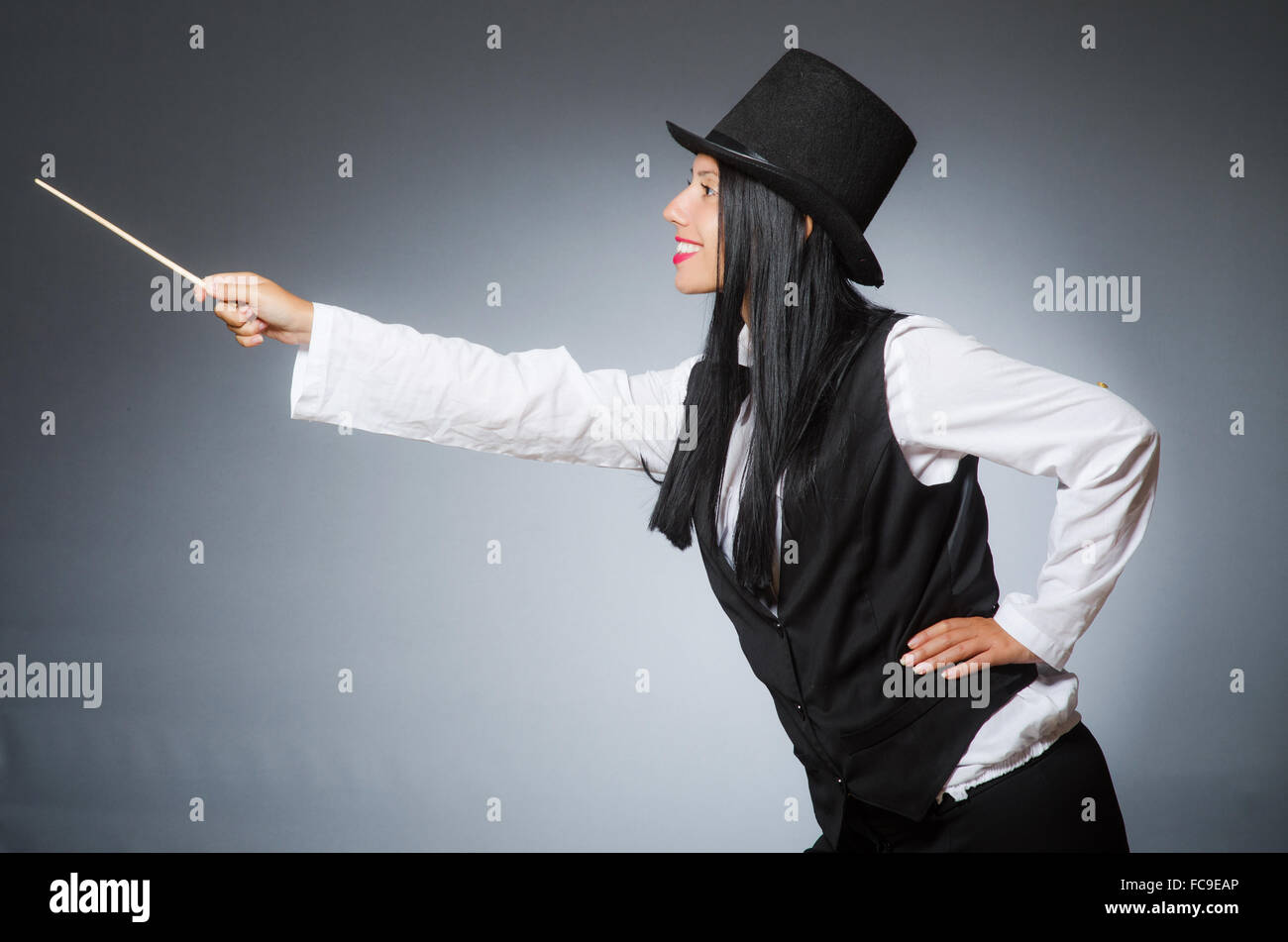 Woman magician in funny concept Stock Photo - Alamy