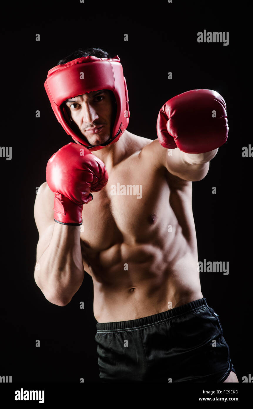 Muscular man in boxing concept Stock Photo - Alamy