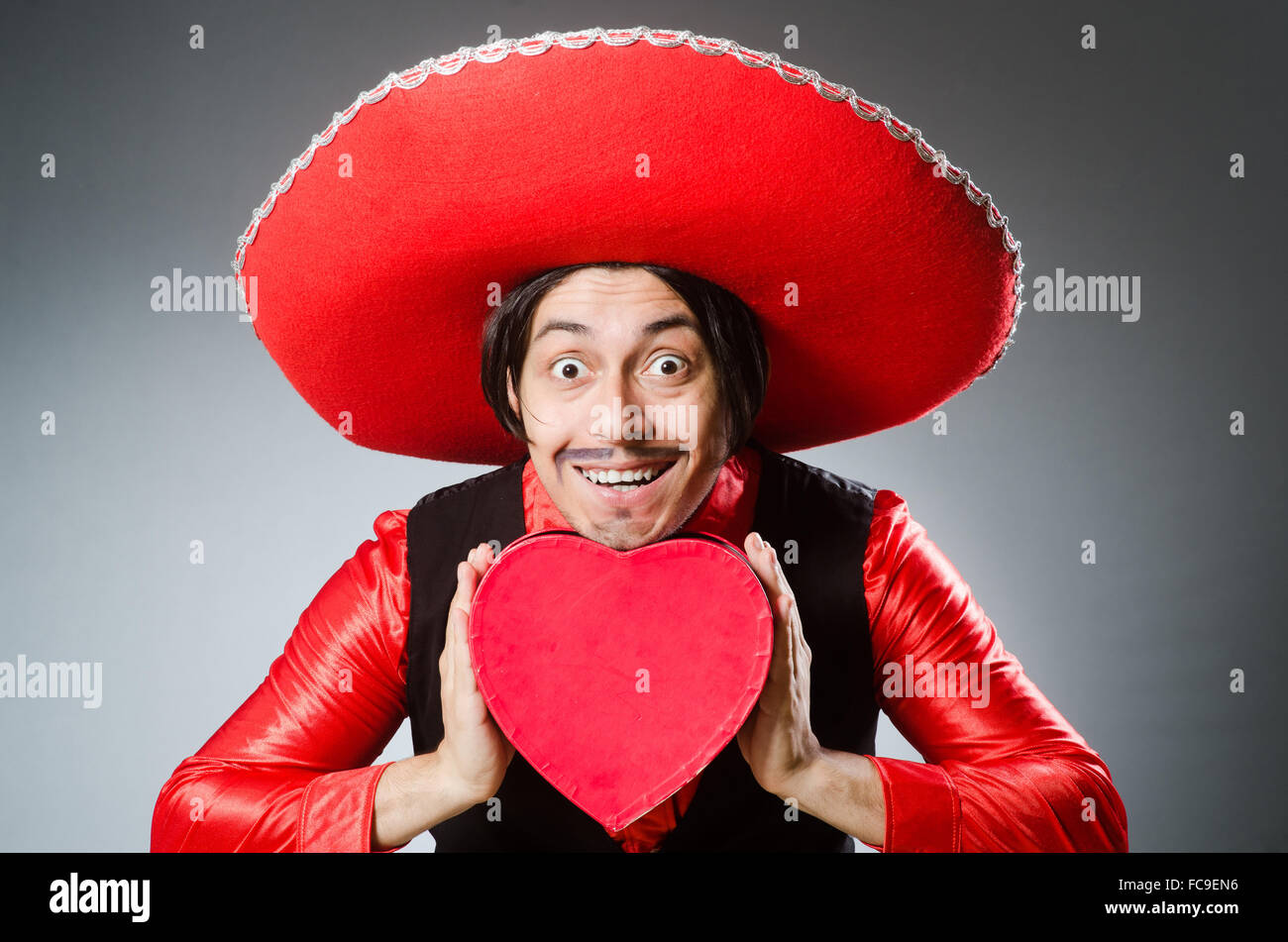 Person wearing sombrero hat in funny concept Stock Photo - Alamy