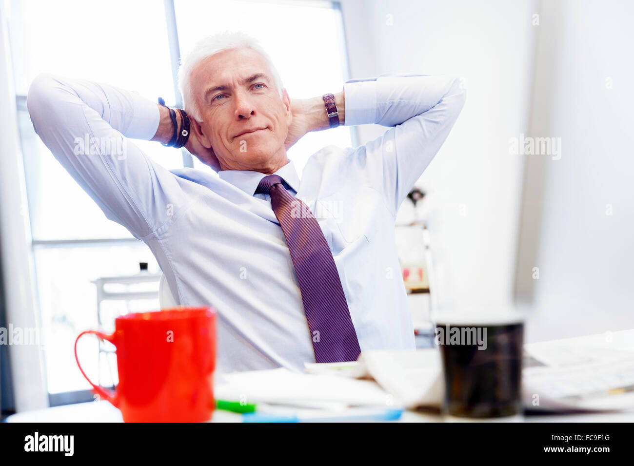 Executive resting on chair hi-res stock photography and images - Alamy