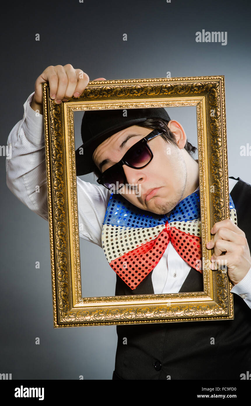 Funny man with picture frame Stock Photo - Alamy