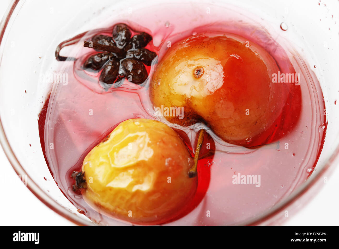 Red apple in rose syrup Stock Photo - Alamy
