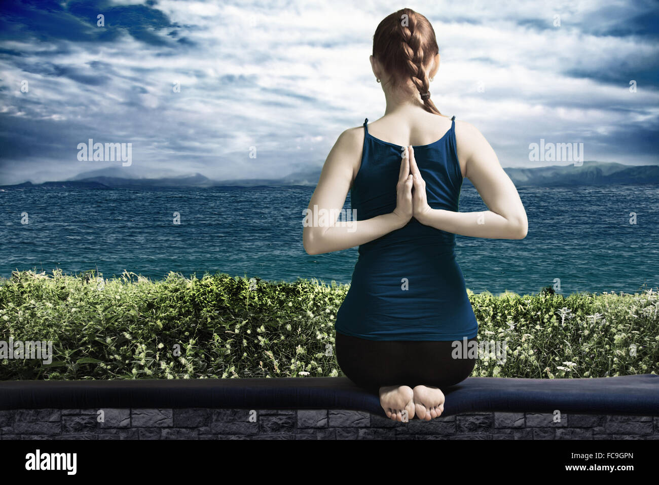 Yoga on terrace Stock Photo - Alamy