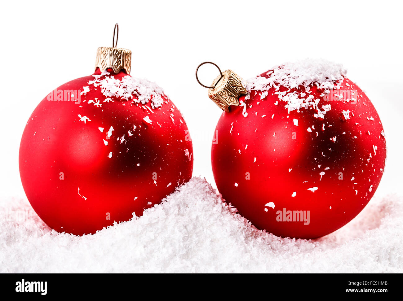 red Christmas ball in the snow Stock Photo - Alamy