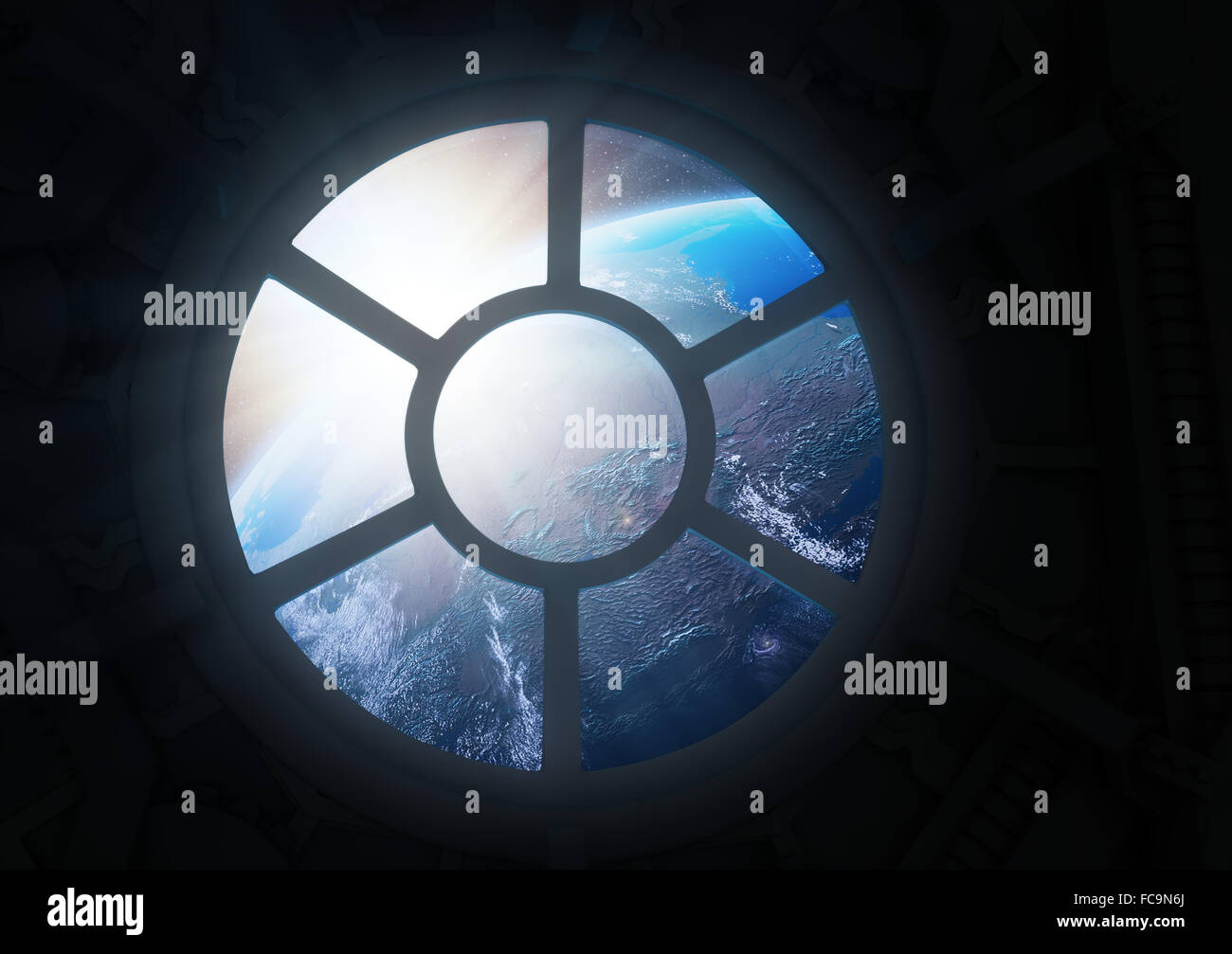 A round window on a space station with a view of Earth below Stock ...
