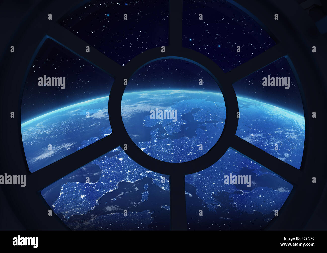 A round window on a space station with a view of Earth below Stock ...