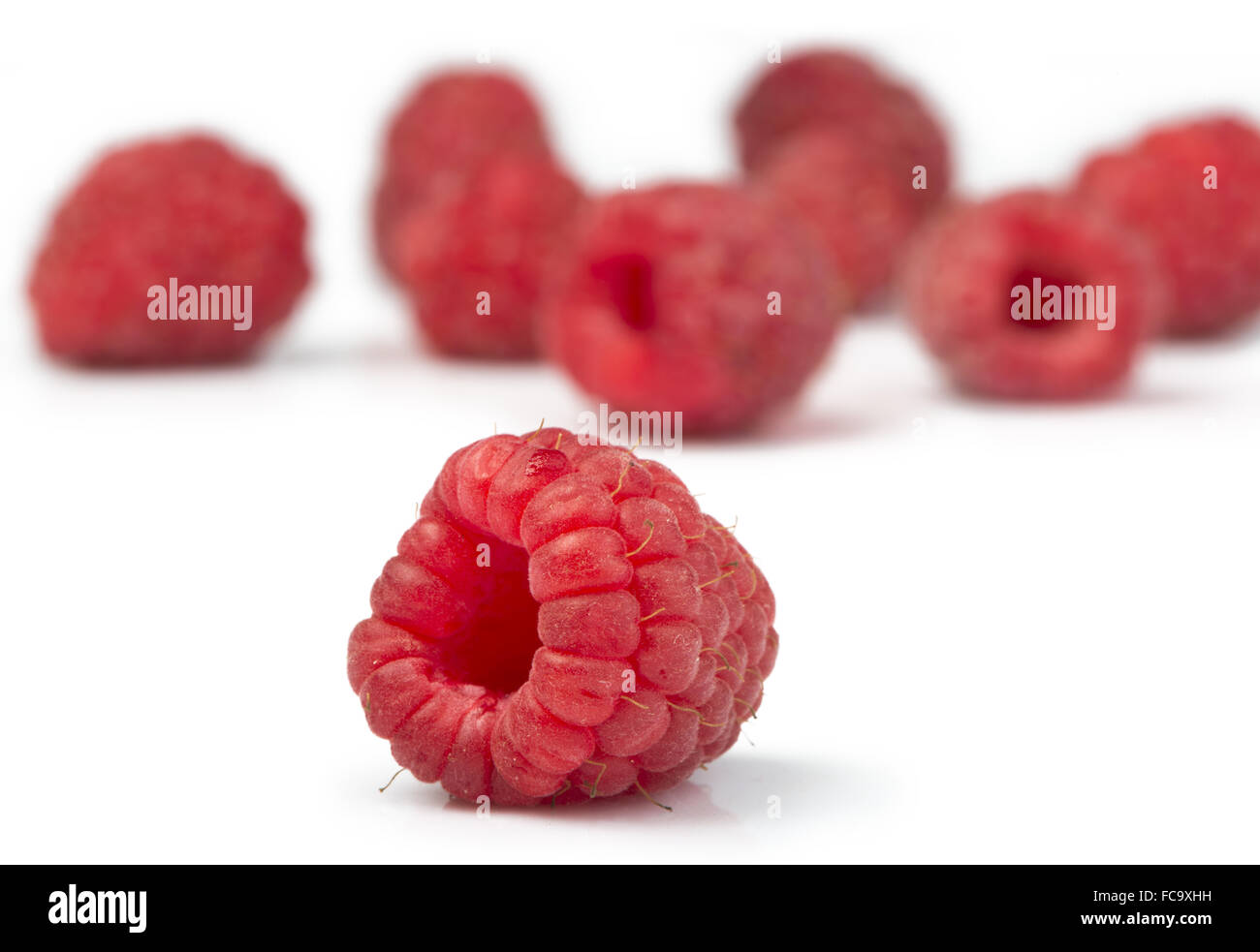 Raspberries white isolated Stock Photo - Alamy
