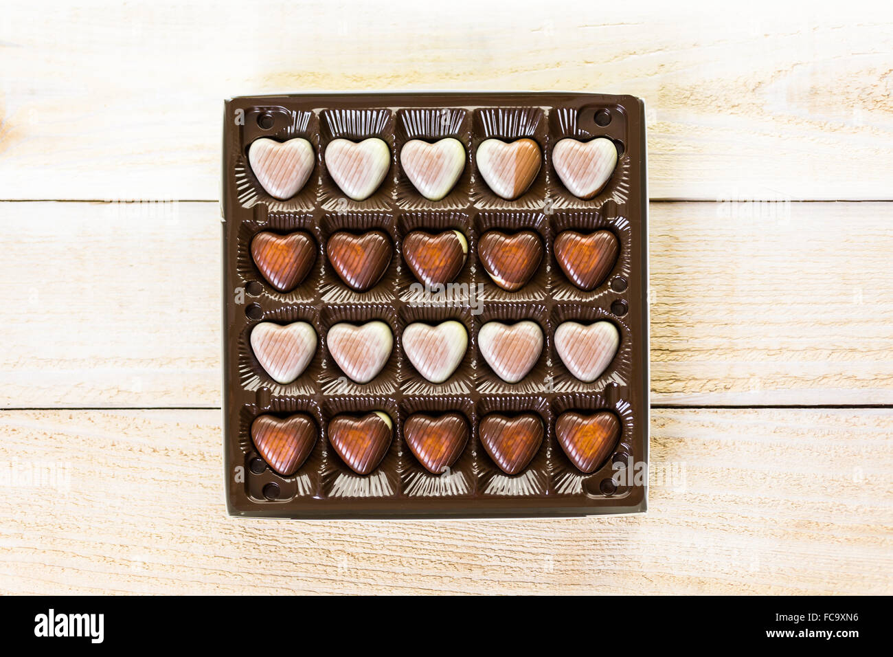 Square box with heart shaped chocolates for Valentines Day Stock Photo ...