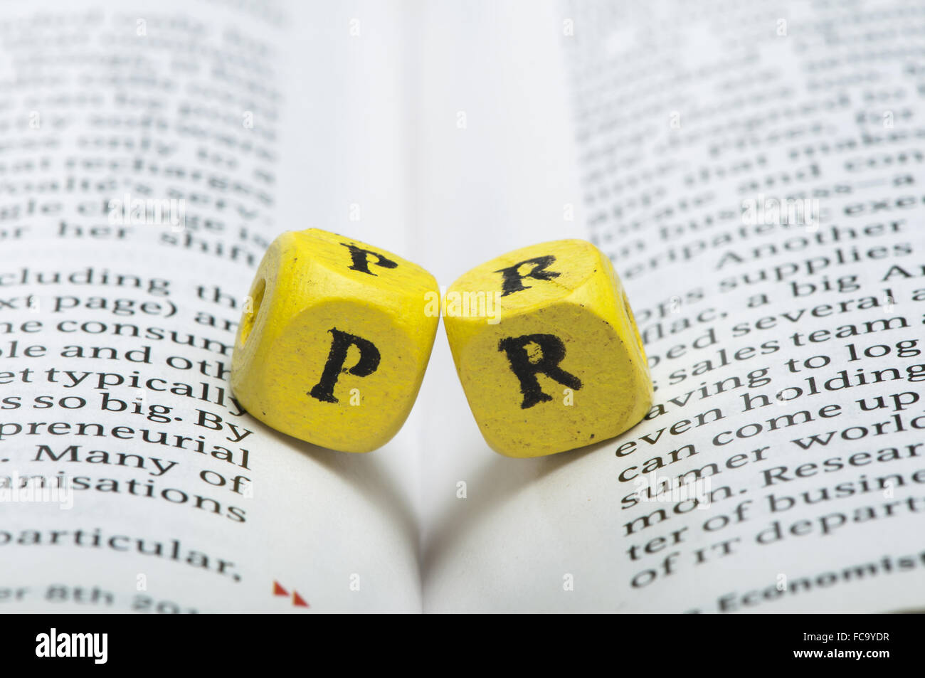 Word PR.Wooden cubes on magazine Stock Photo - Alamy