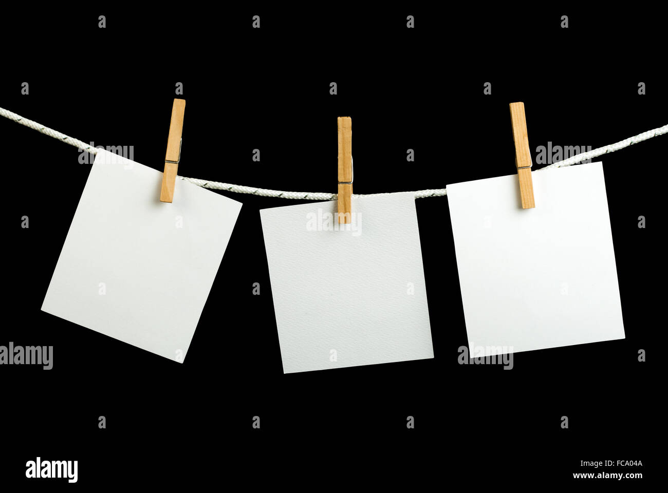 Note papers hooked on a rope Stock Photo - Alamy