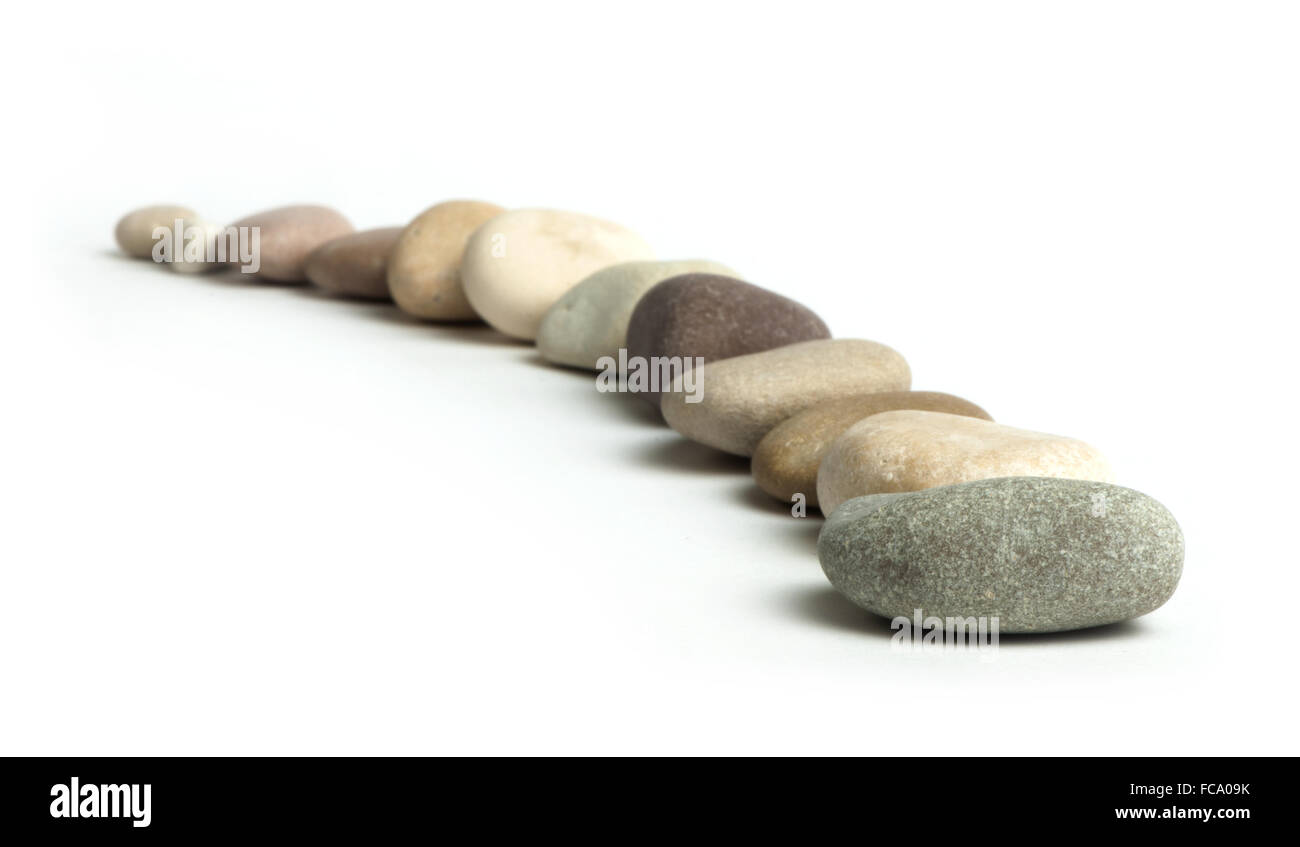 Stacked stones white isolated Stock Photo - Alamy