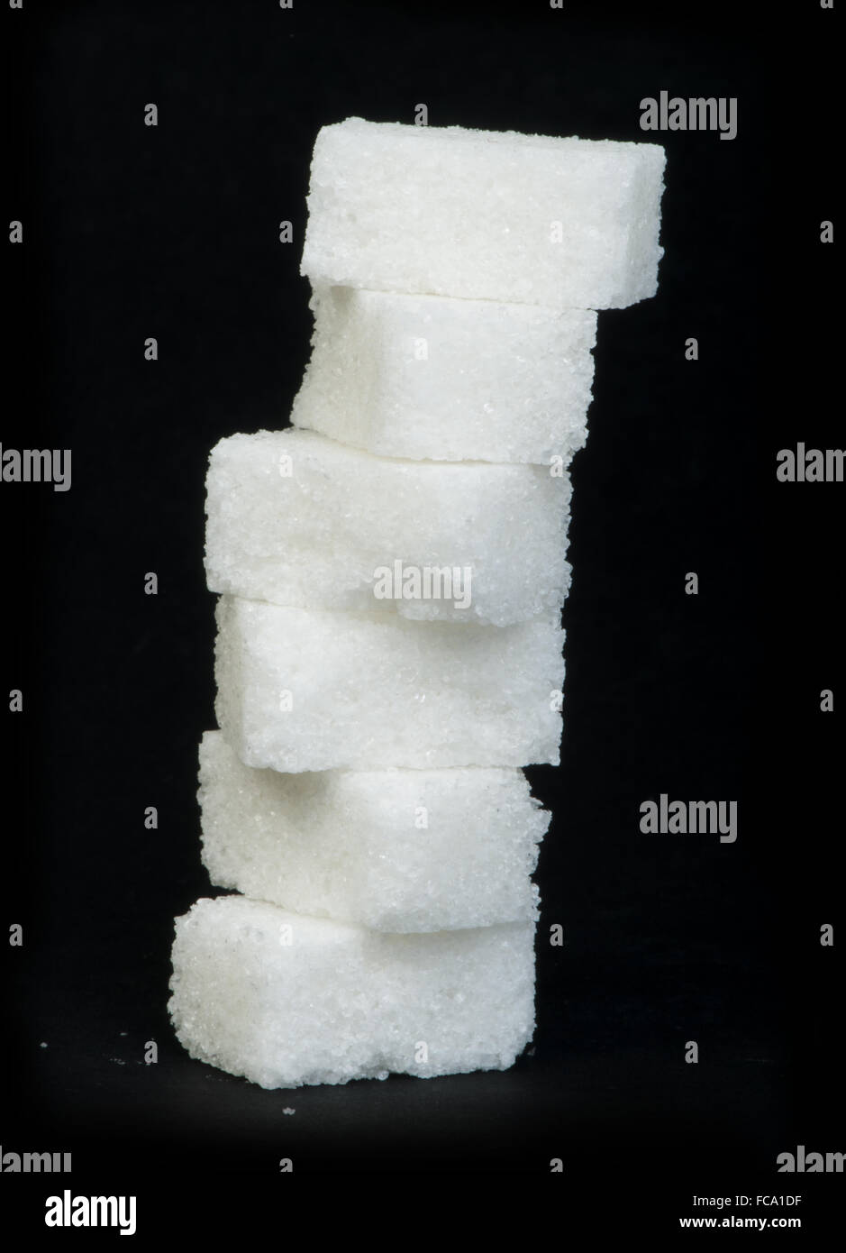 Sugar lumps black isolated Stock Photo - Alamy