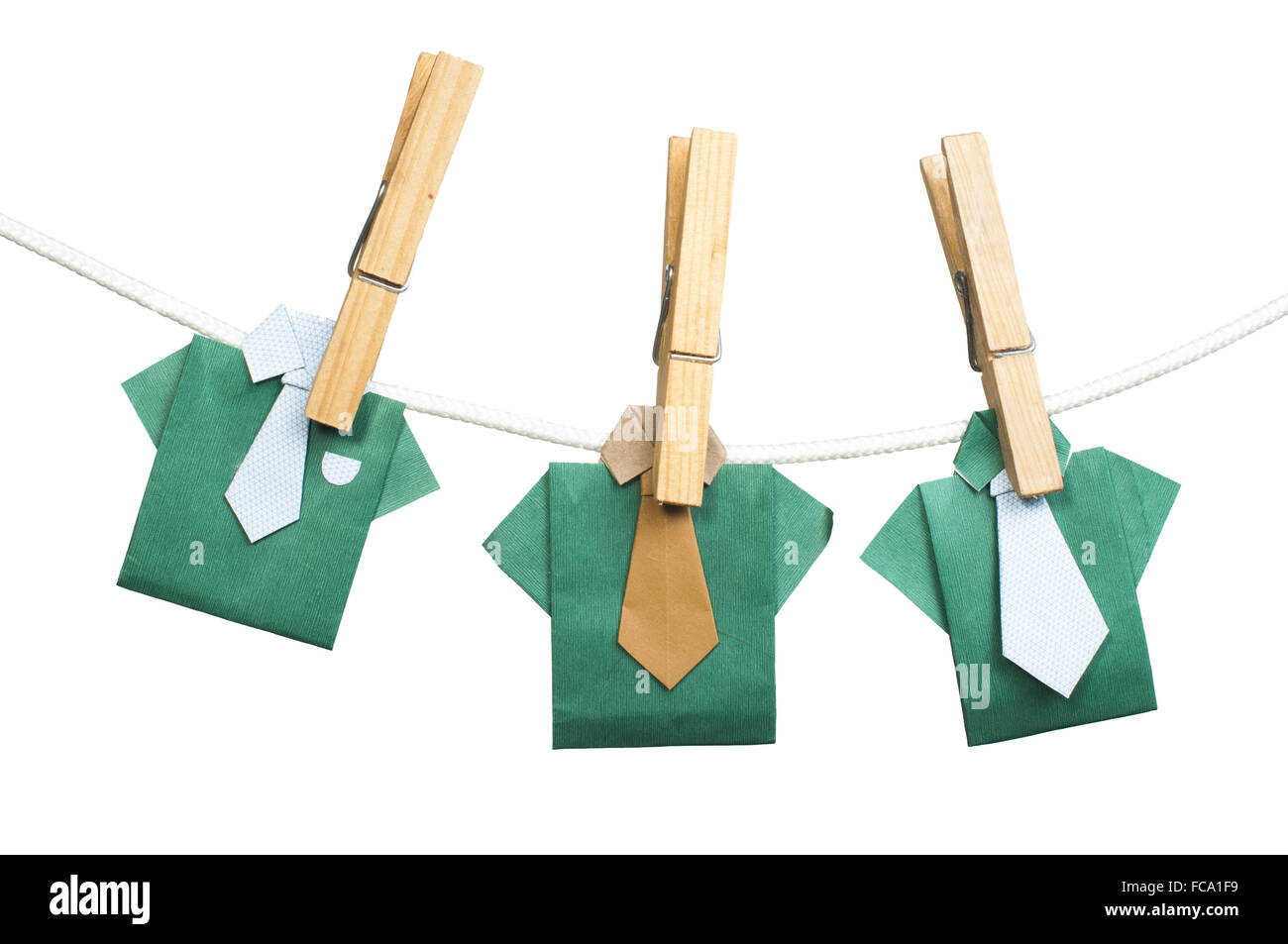 Origami shirts on rope Stock Photo - Alamy