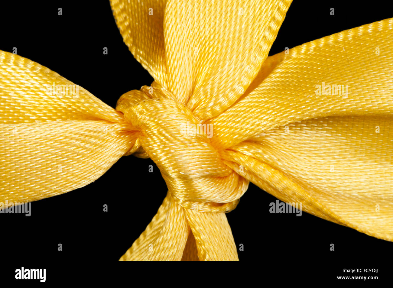 Yellow ribbon and knot isolated Stock Photo - Alamy