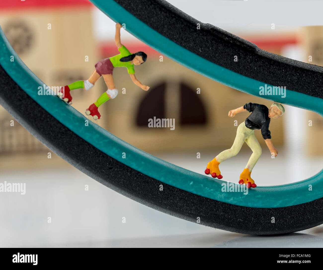 little people fun on Scissors Scating Stock Photo - Alamy
