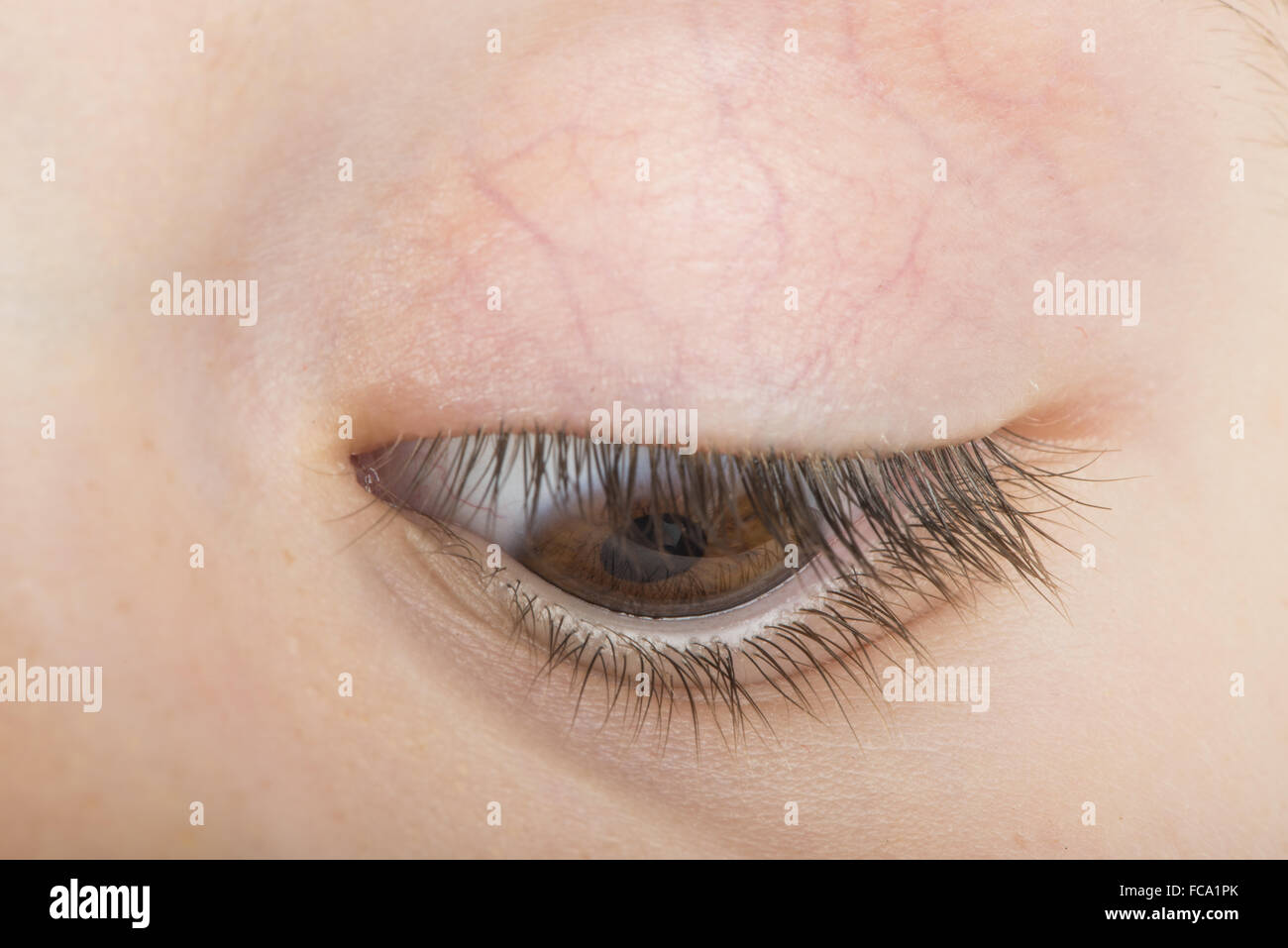 Human eye looking to down Stock Photo - Alamy