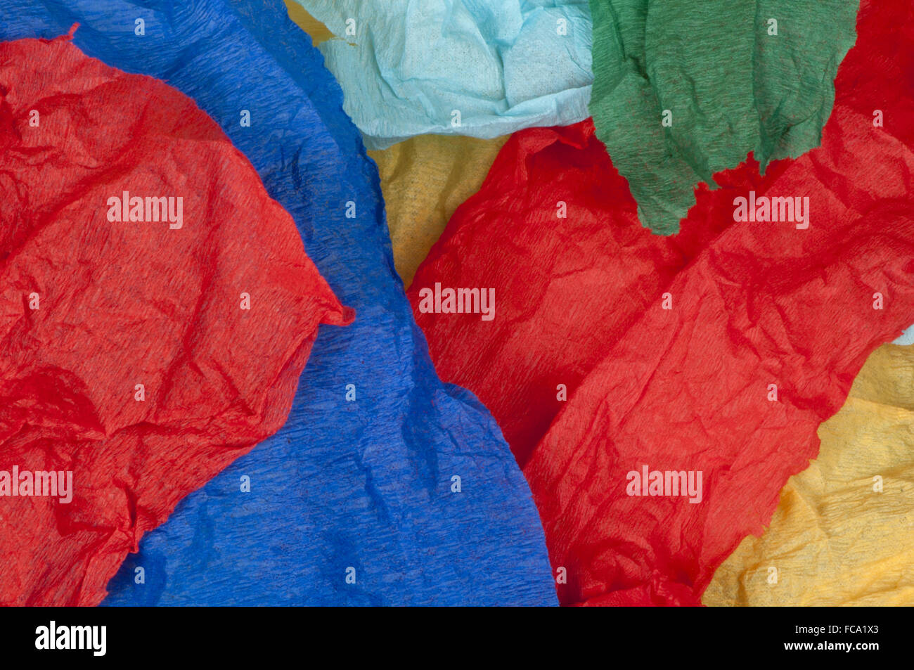 Many colorful pieces of torn paper Stock Photo - Alamy