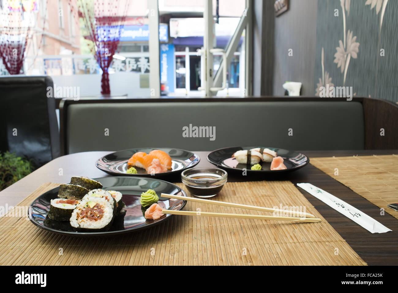 Sushi in sushi bar Stock Photo - Alamy