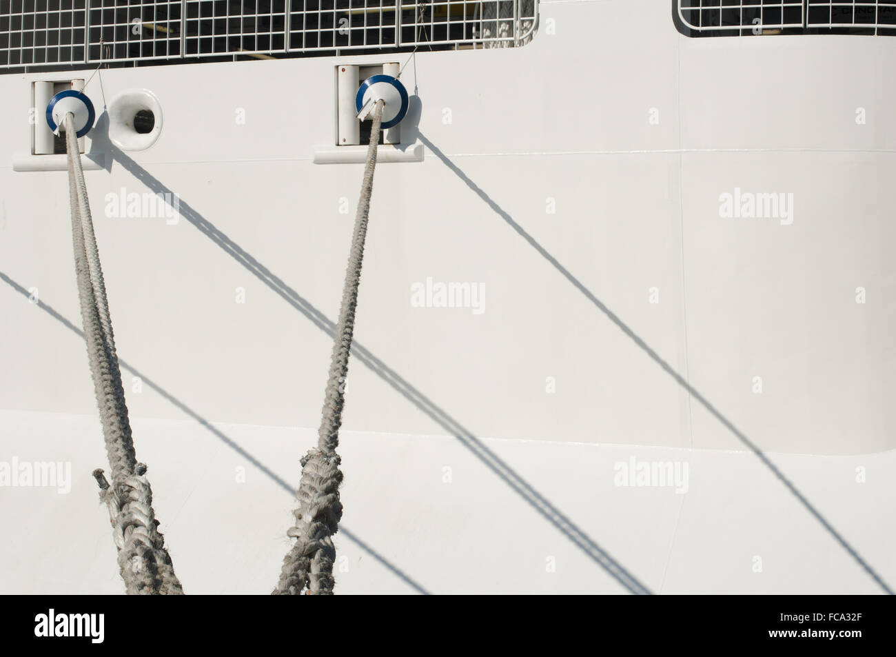 Ship ropes and moored ship Stock Photo - Alamy