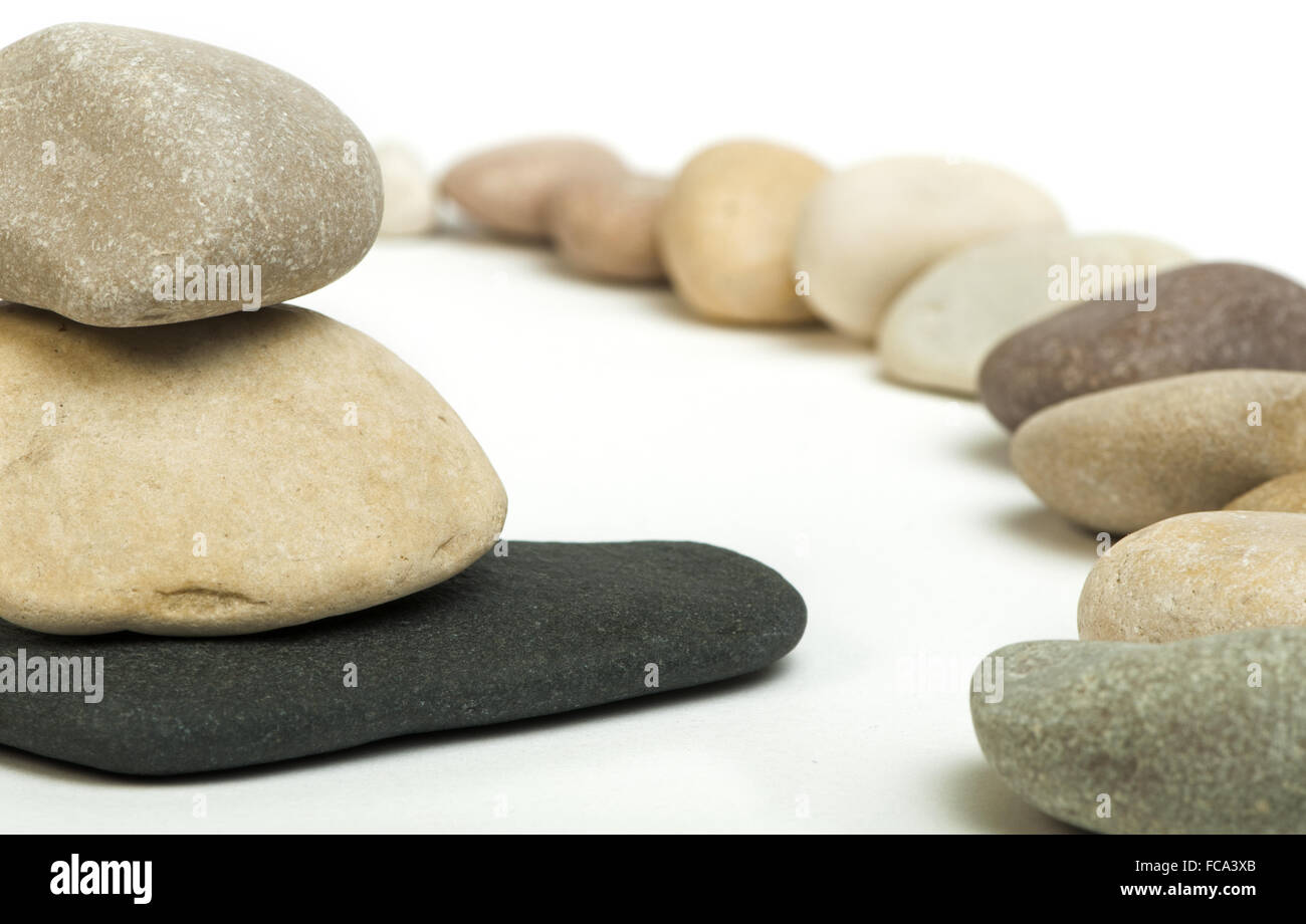 Stacked stones white isolated Stock Photo - Alamy