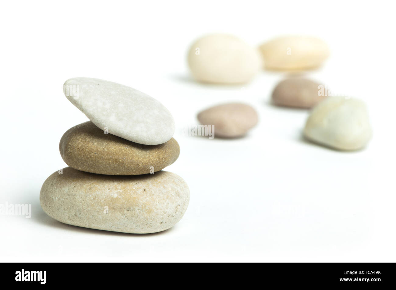 Stacked stones white isolated Stock Photo - Alamy