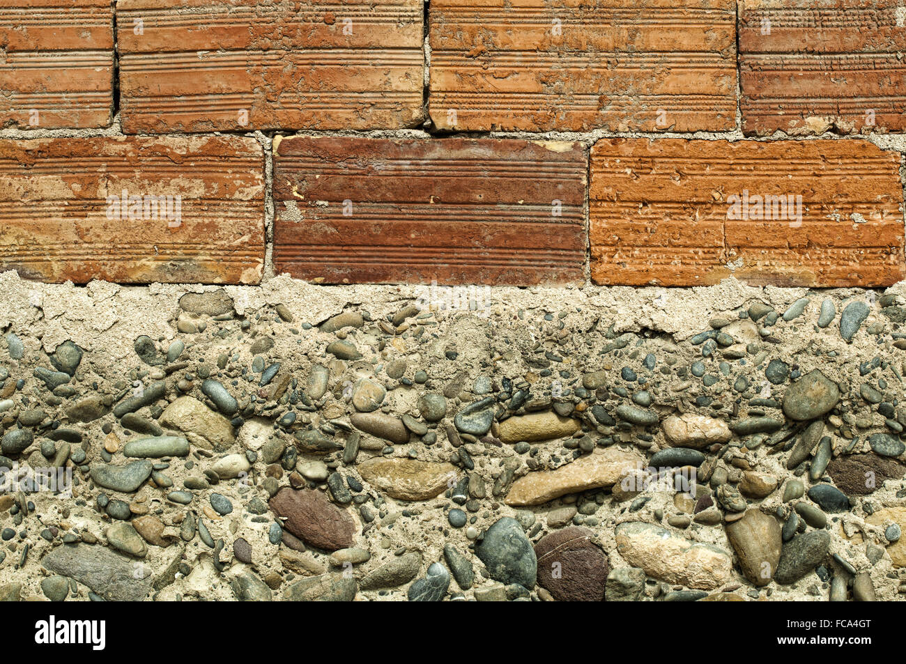 Wall of bricks and stones Stock Photo - Alamy