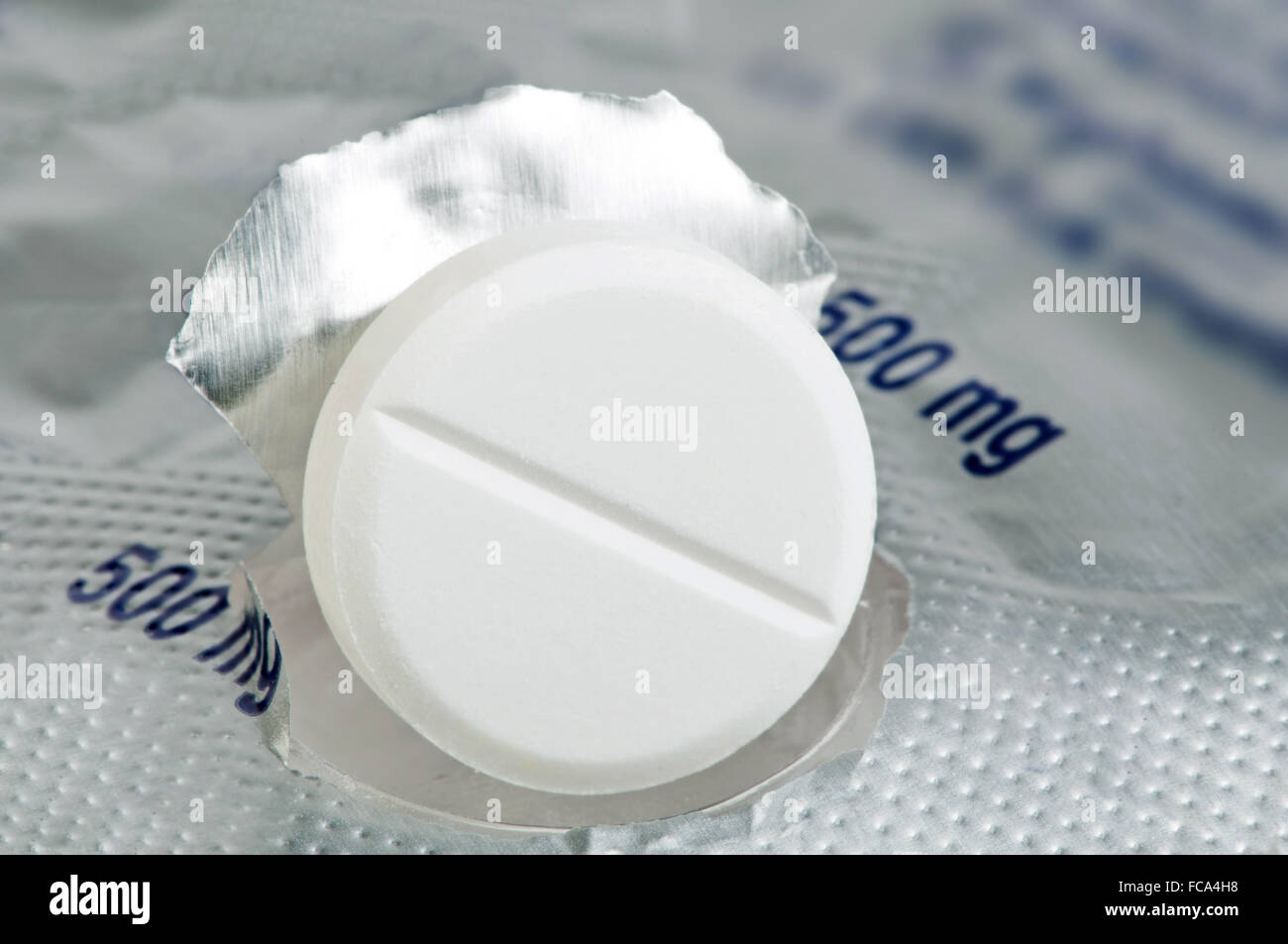 White pill in a pack very close up Stock Photo - Alamy