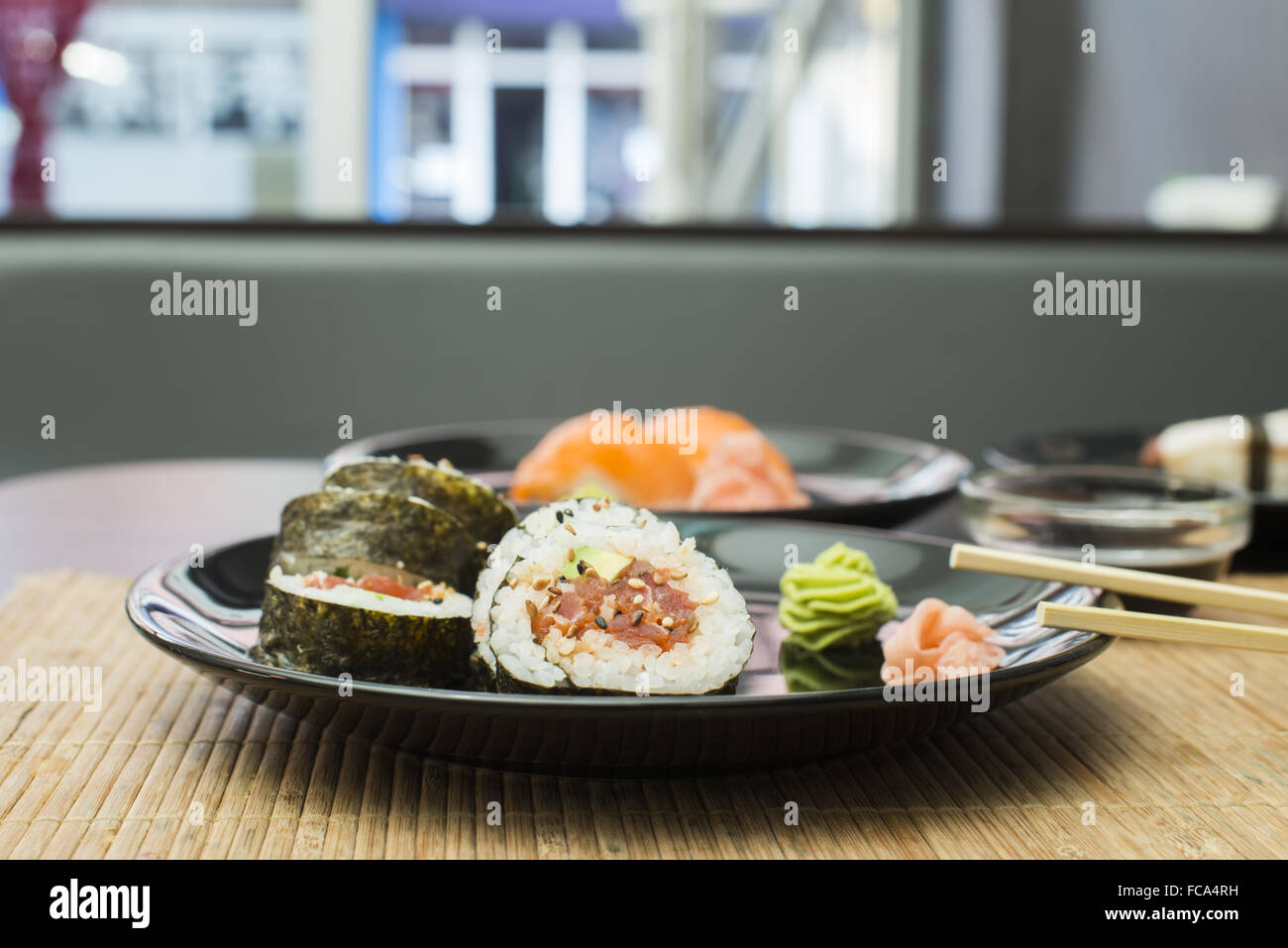 Sushi in sushi bar Stock Photo - Alamy