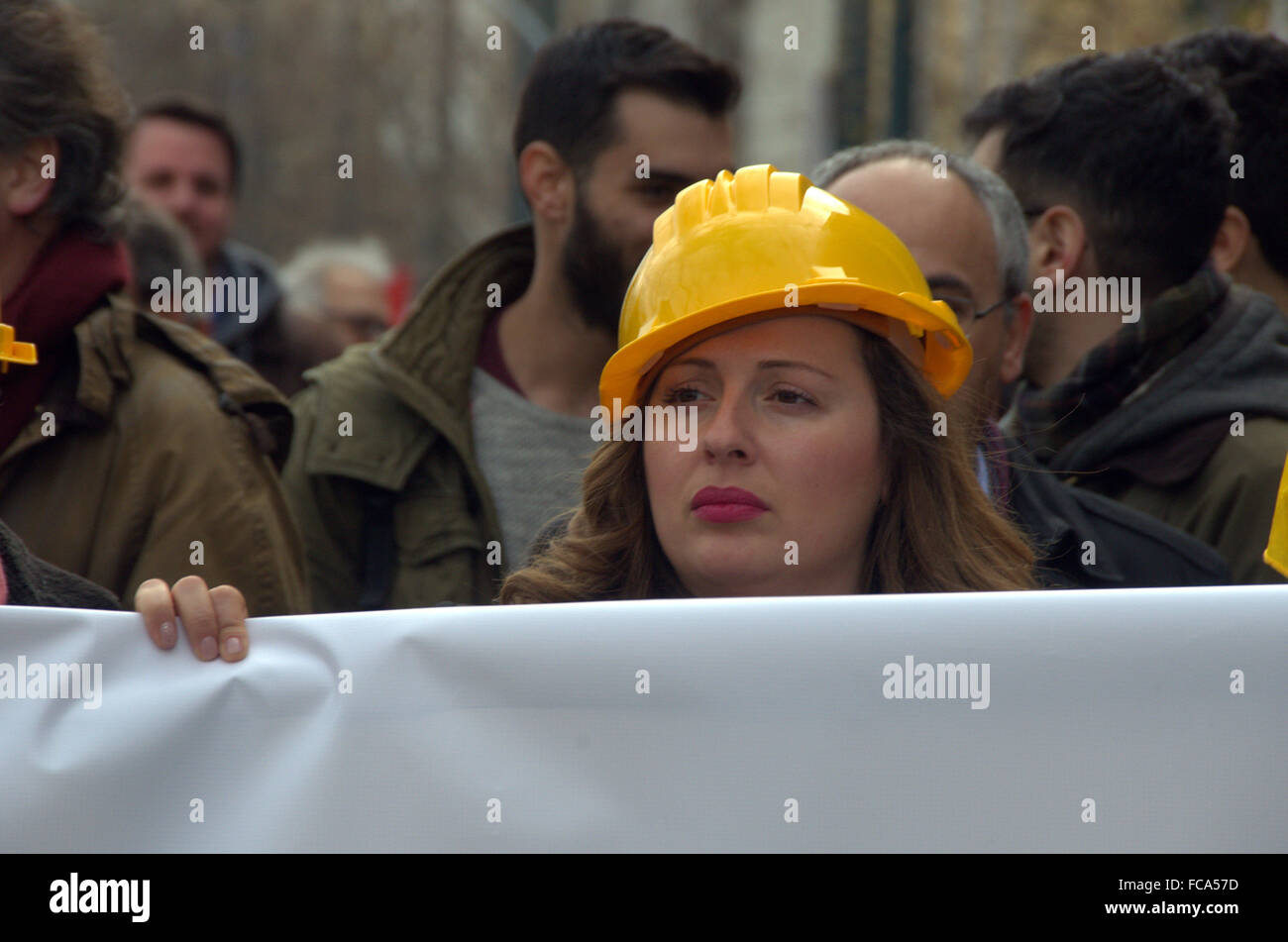 Athens, Greece. 21st Jan, 2016. A woman wearing yellow hat holding a ...